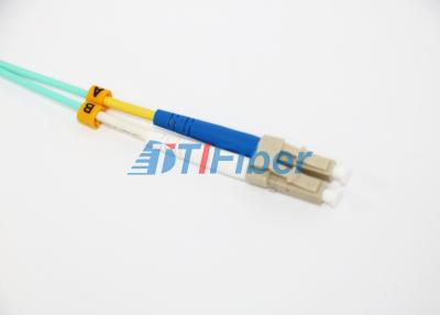 China Cordón de remiendo a dos caras de la fibra óptica OM4 Lc al cable del remiendo del Lc con la virola de cerámica en venta
