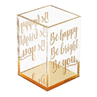 China Customized Plastic Transparent square Pen Holder with Gold Mirrored Base and Gold logo Suitable for Home Office Use for sale