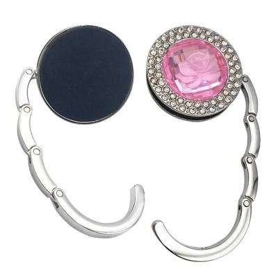 China Portable Foldable Purse Hook Round Double Diamond Flower Bag Hanger Handbag hook for sale
